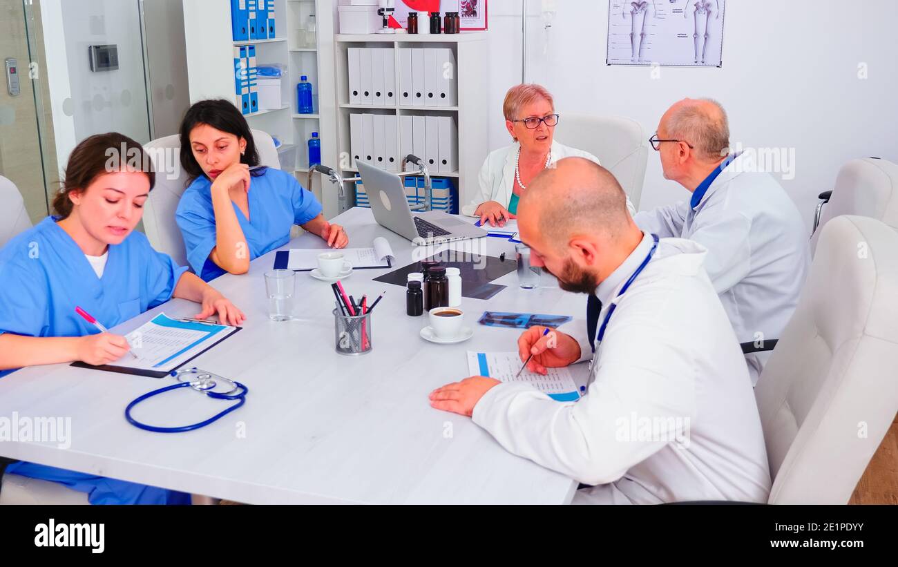 Medical practioner checking list patients hi-res stock photography and ...