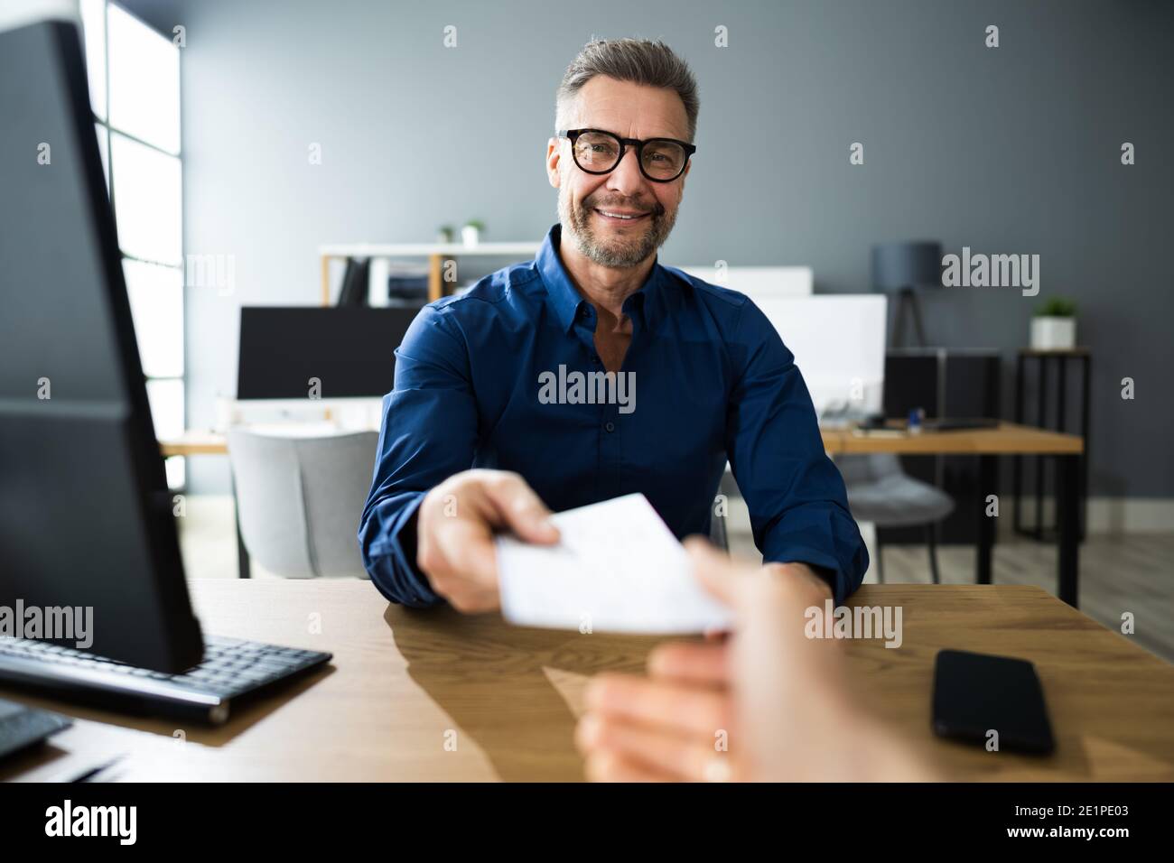Executive Hand Giving Payment Check Or Compensation Cheque Stock Photo ...