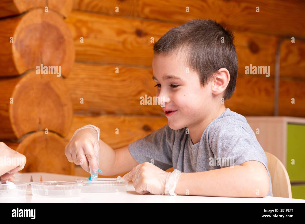 Chemistry education and study concept. Close-up of a smilling boy ...