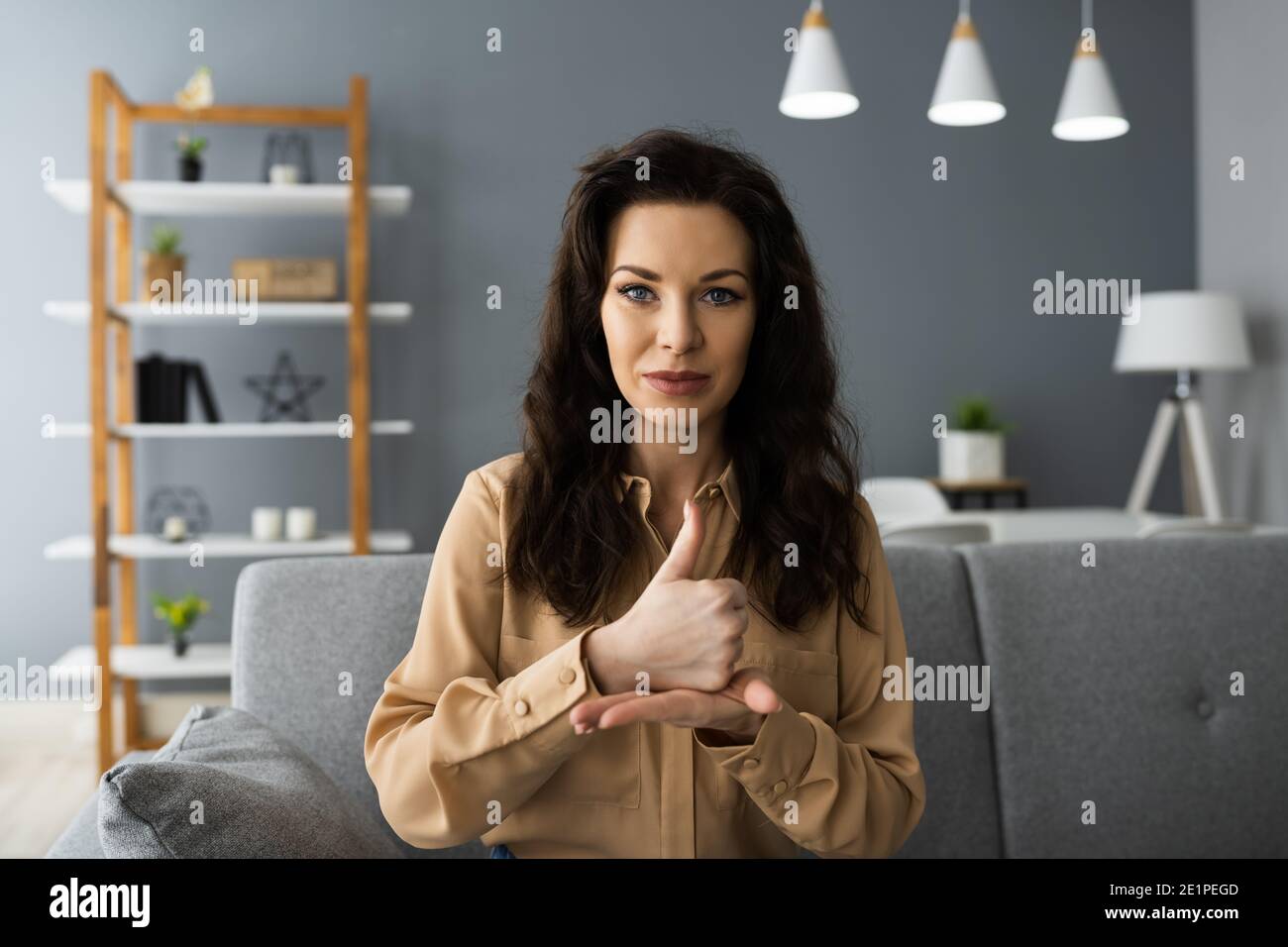 Adult Learning Sign Language For Deaf Disabled Stock Photo - Alamy