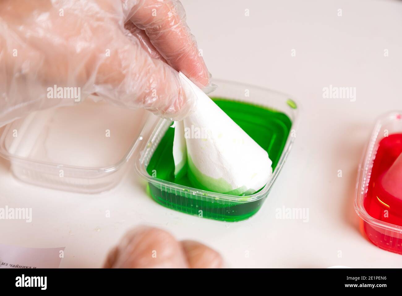 Chemistry education and training concept. Close-up of a woman dipping a ...