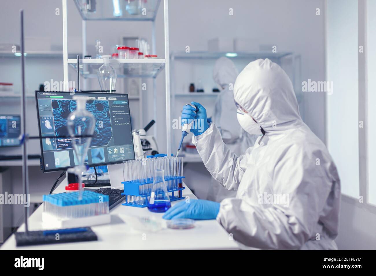 Man glasses pipette biochemistry mask hi-res stock photography and ...