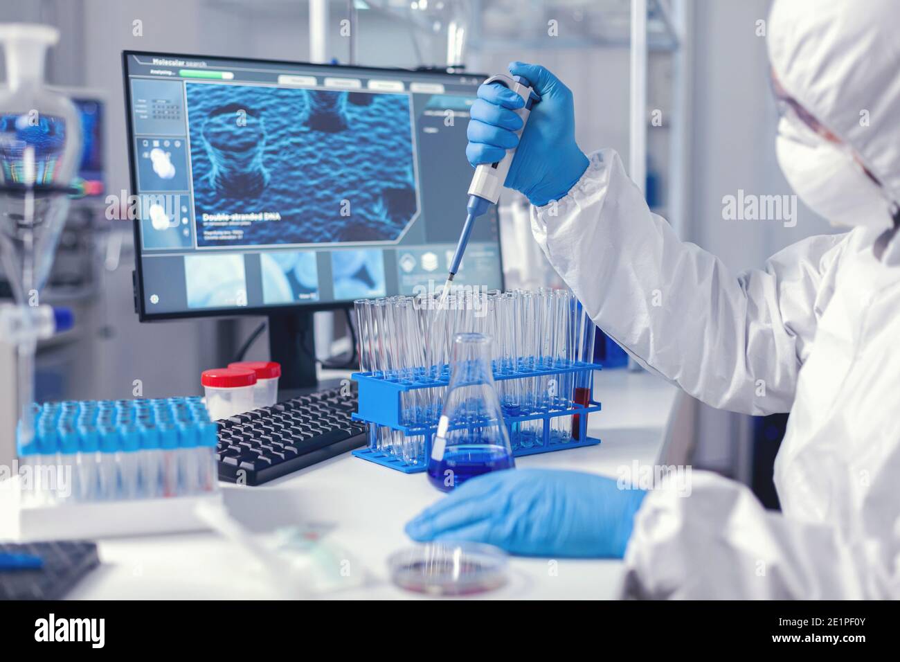Medic assistant working in biochemistry lab working with automatic ...