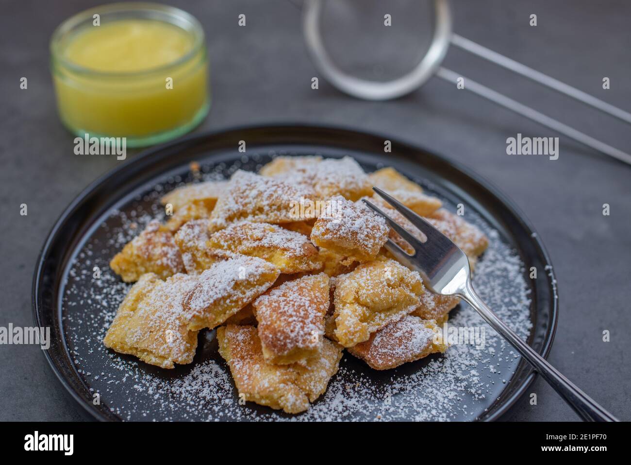 Austrian cuisine. Torn pancake (or omelet) kaiserschmarrn with honey ...