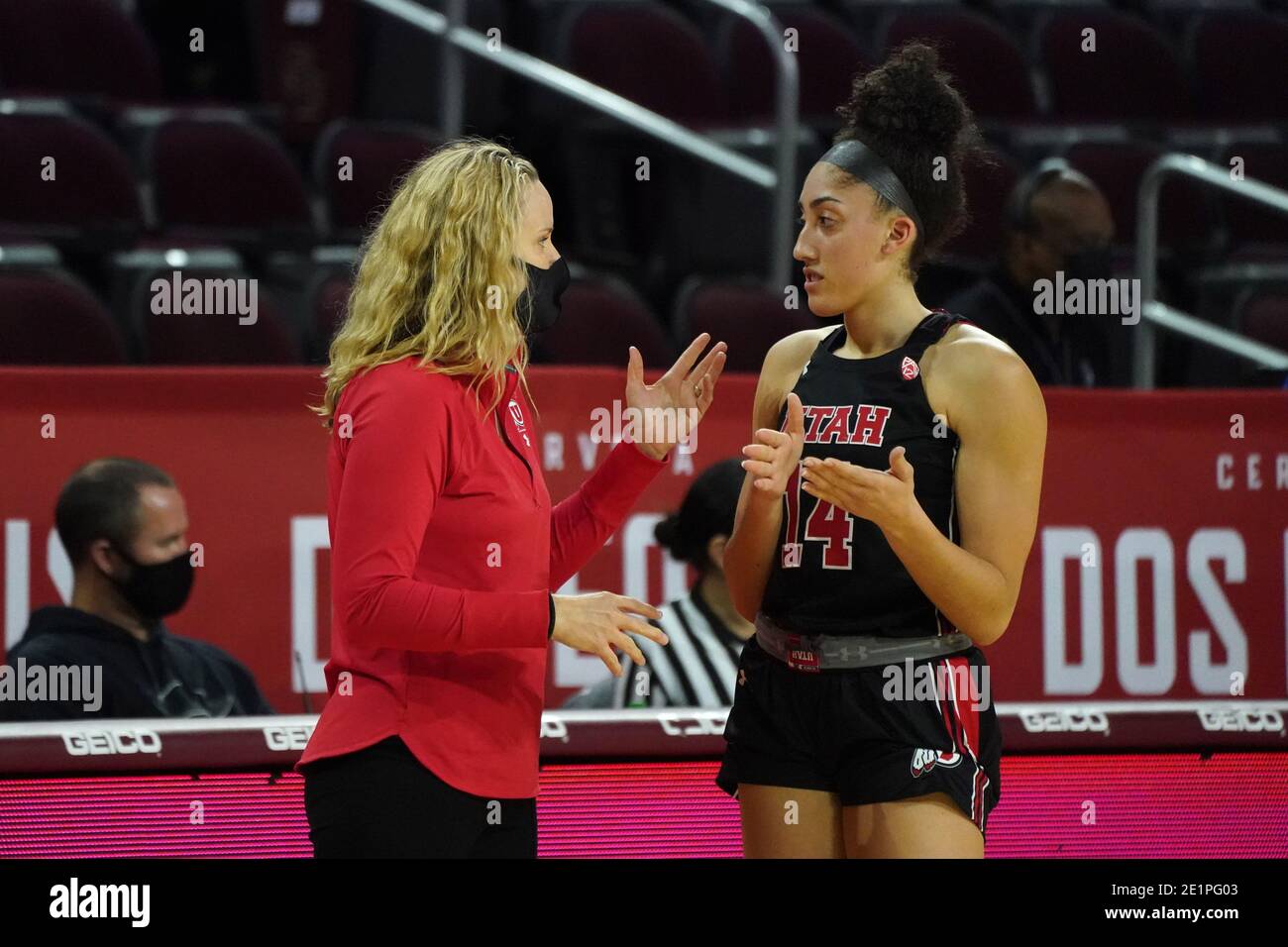 Utah Utes head coach Lynne Roberts talks with guard Niyah Becker (14 ...