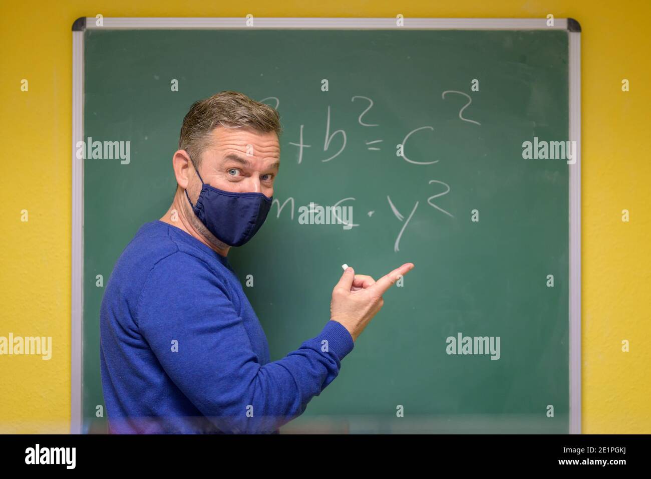 Mathematics teacher wearing a face mask during the Covid-19 pandemic ...