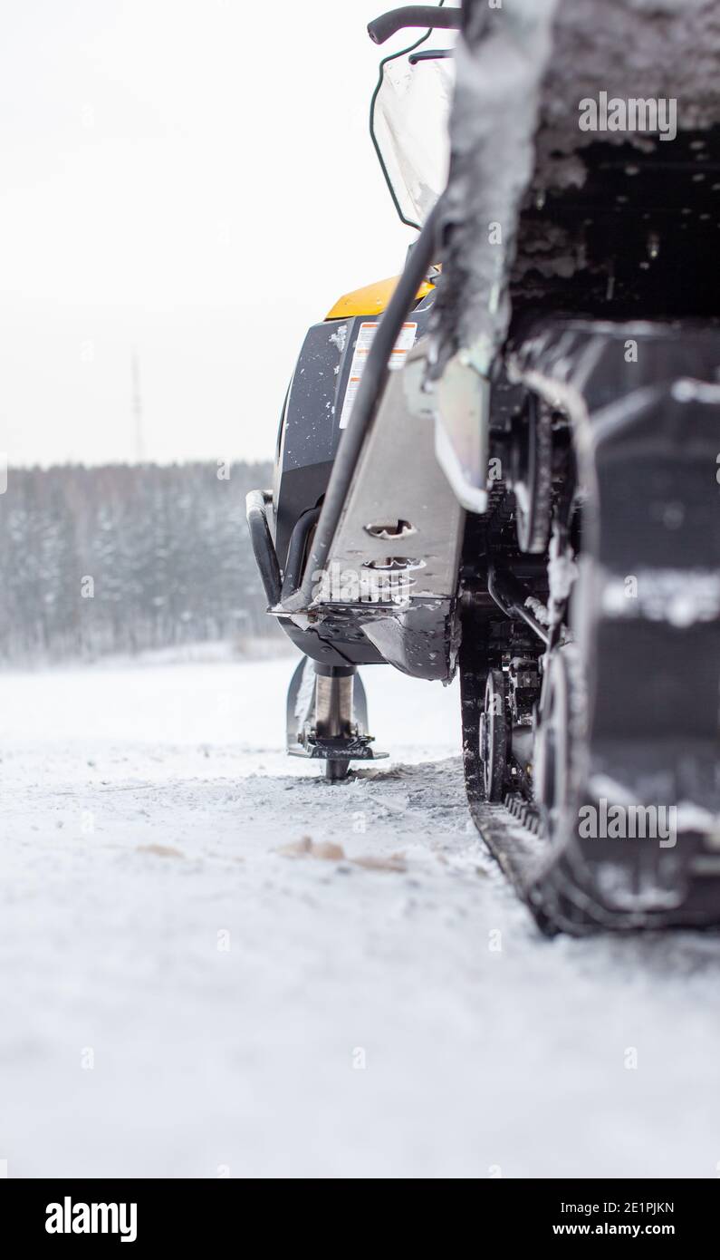 The back of the snowmobile in winter. Riding in the snow on a ...