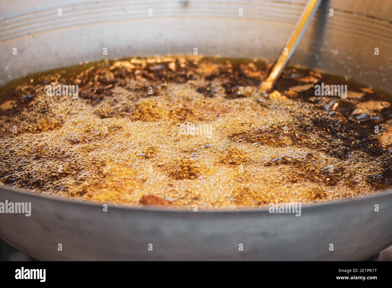Food concept. Boiling oil in metal bowl in Thailand fresh food market ...