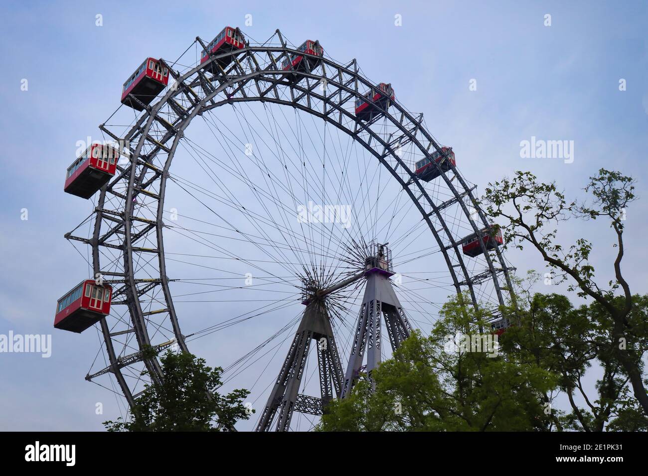 Ferris wheel against a blue sky on a spring evening at Prater amusement ...