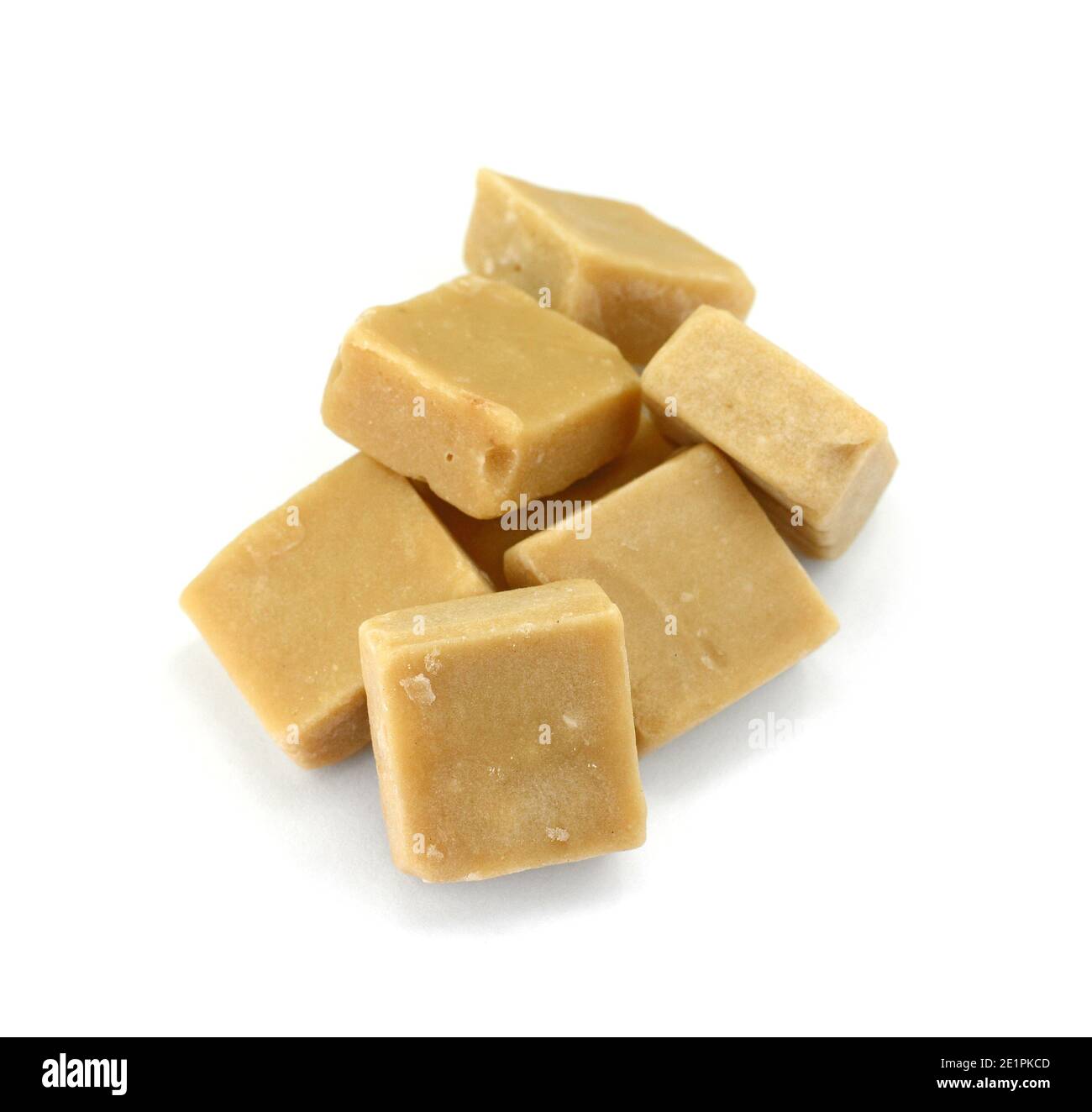 Sweet caramel candies isolated on white background Stock Photo - Alamy