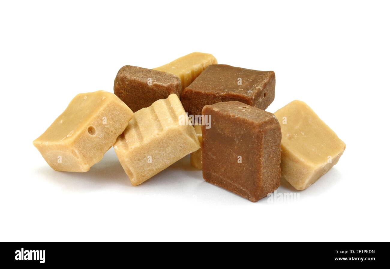 Sweet caramel candies isolated on white background Stock Photo - Alamy