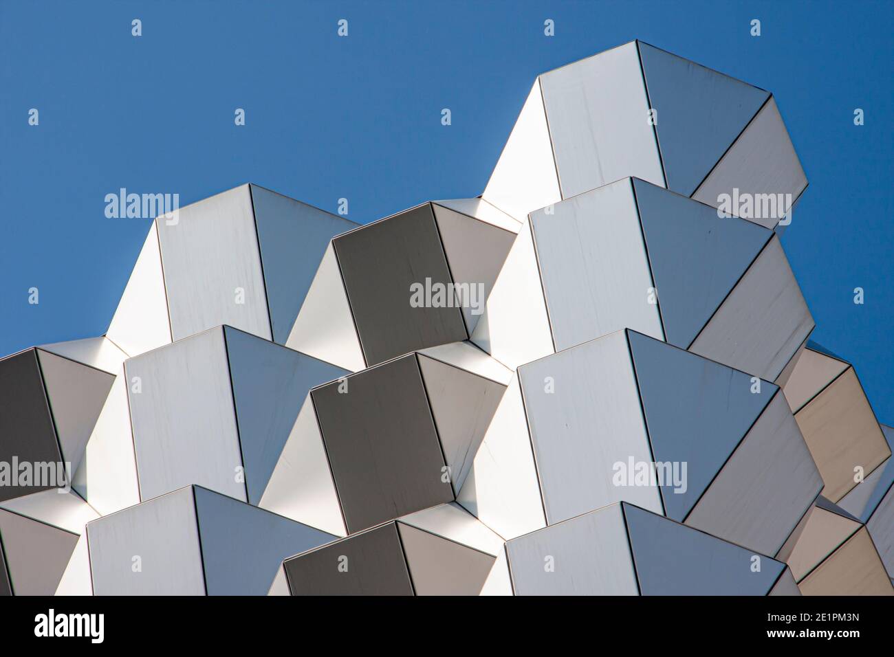 modern facade elements in geometric shapes and blue sky for a ...