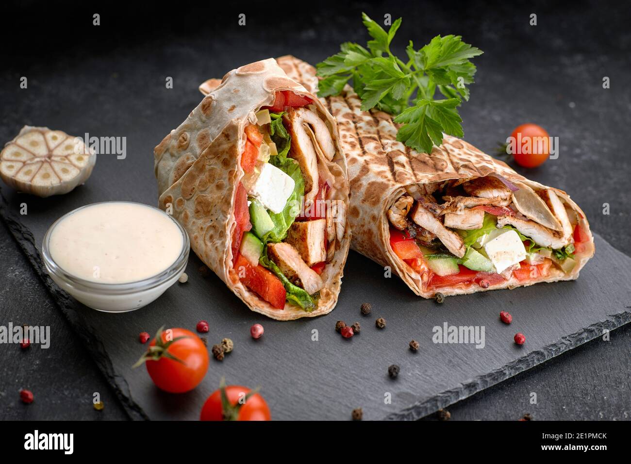Shawarma with meat, cutaway, with sauce, tomatoes, cheese, herbs and ...