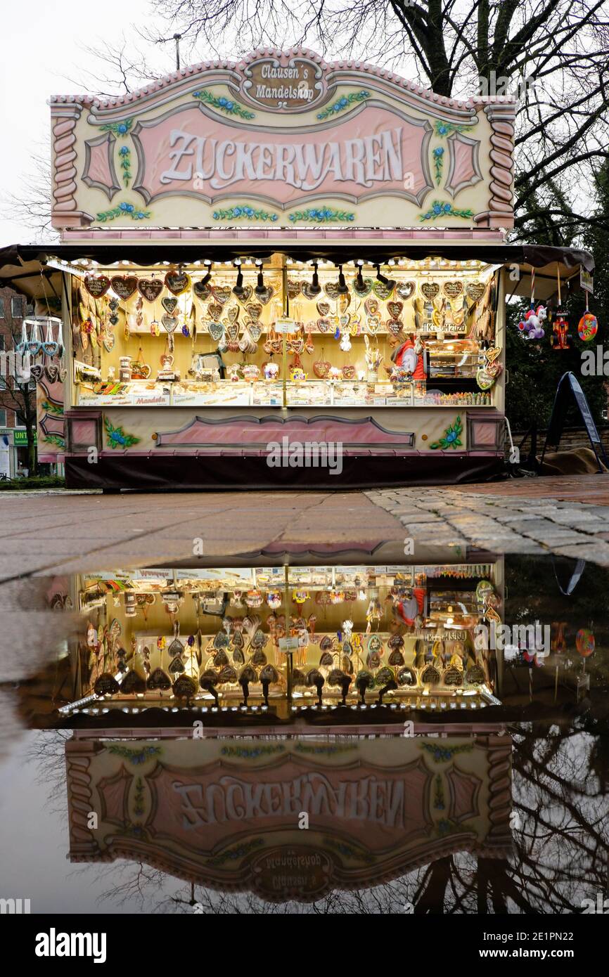 Kiel, Germany. 09th Jan, 2021. An employee waits for customers at a ...
