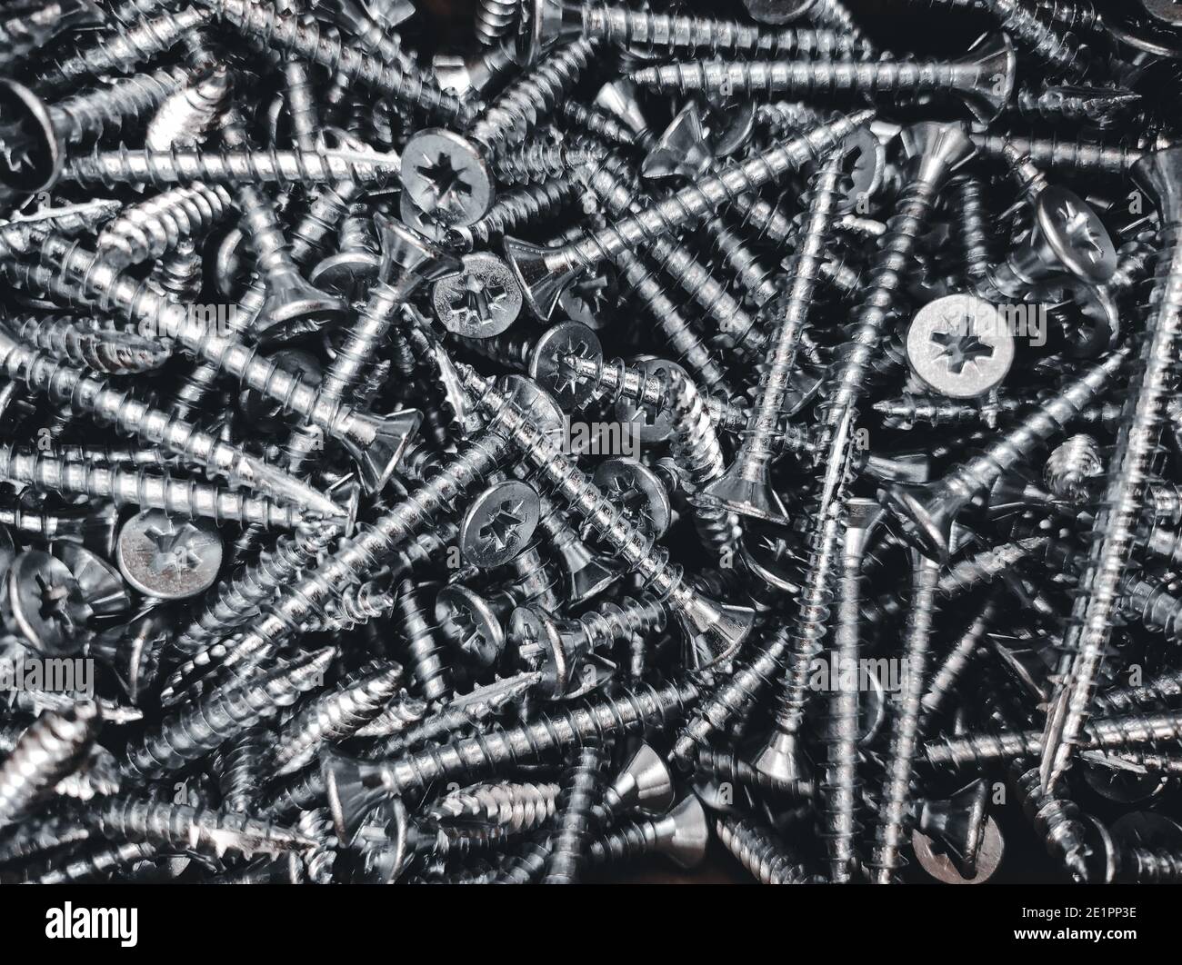 Metallic texture with a lot of new screws Stock Photo - Alamy