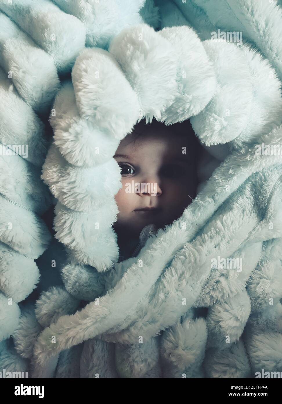 Little baby wrapped up with a warm green blanket Stock Photo - Alamy