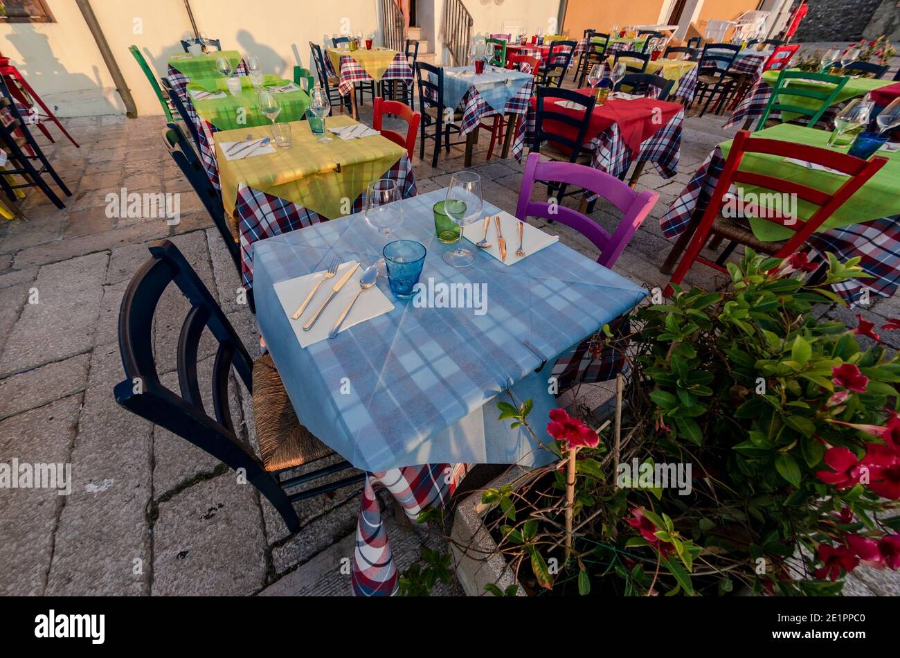 View of the tables set on the street of an outdoor restaurant Stock ...