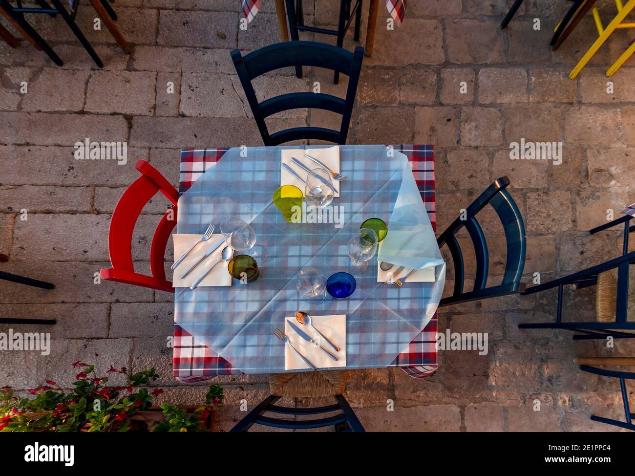 Close-up seen from above of a set table in a restaurant Stock Photo - Alamy