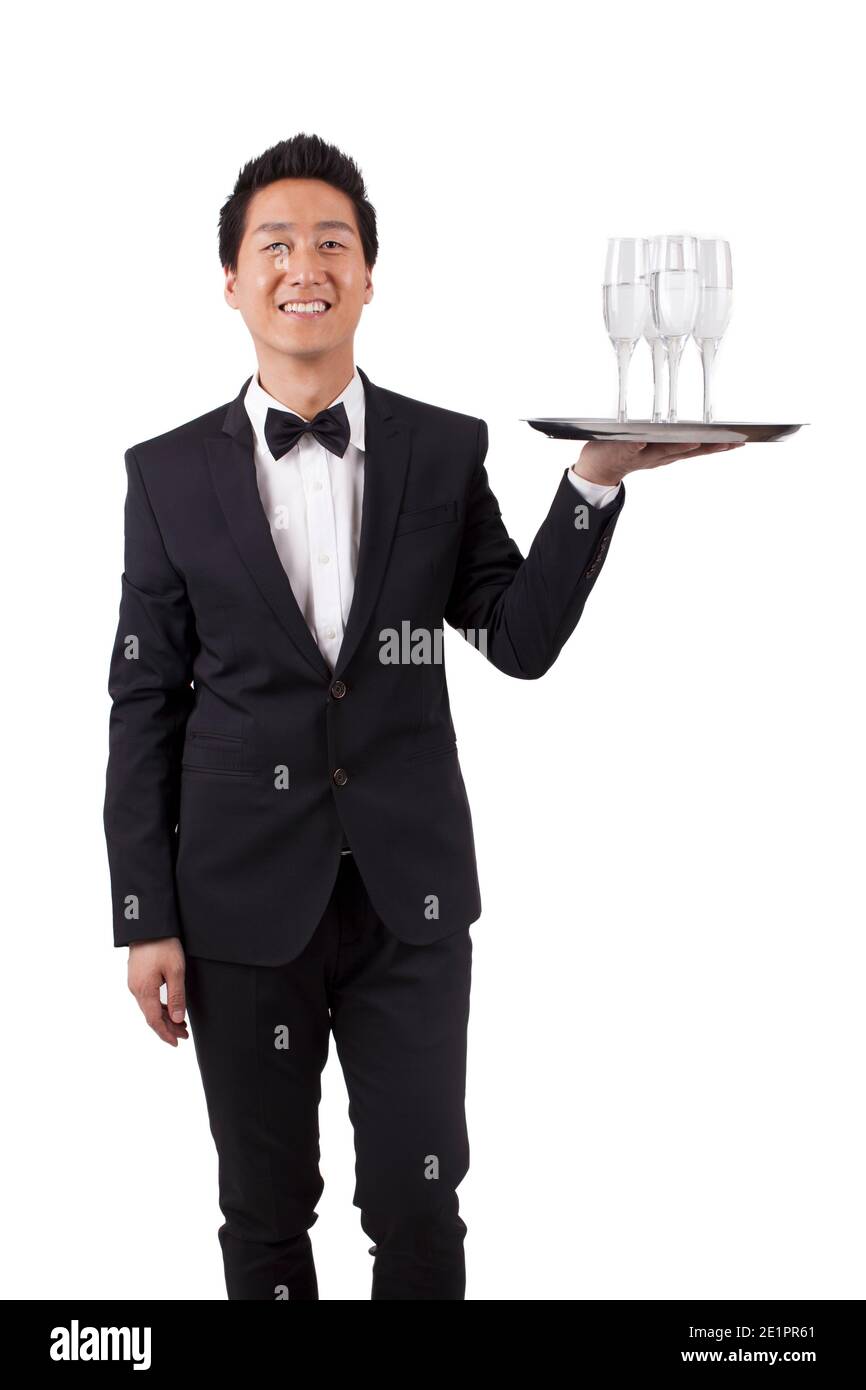 Young butler carrying tray hi-res stock photography and images - Alamy