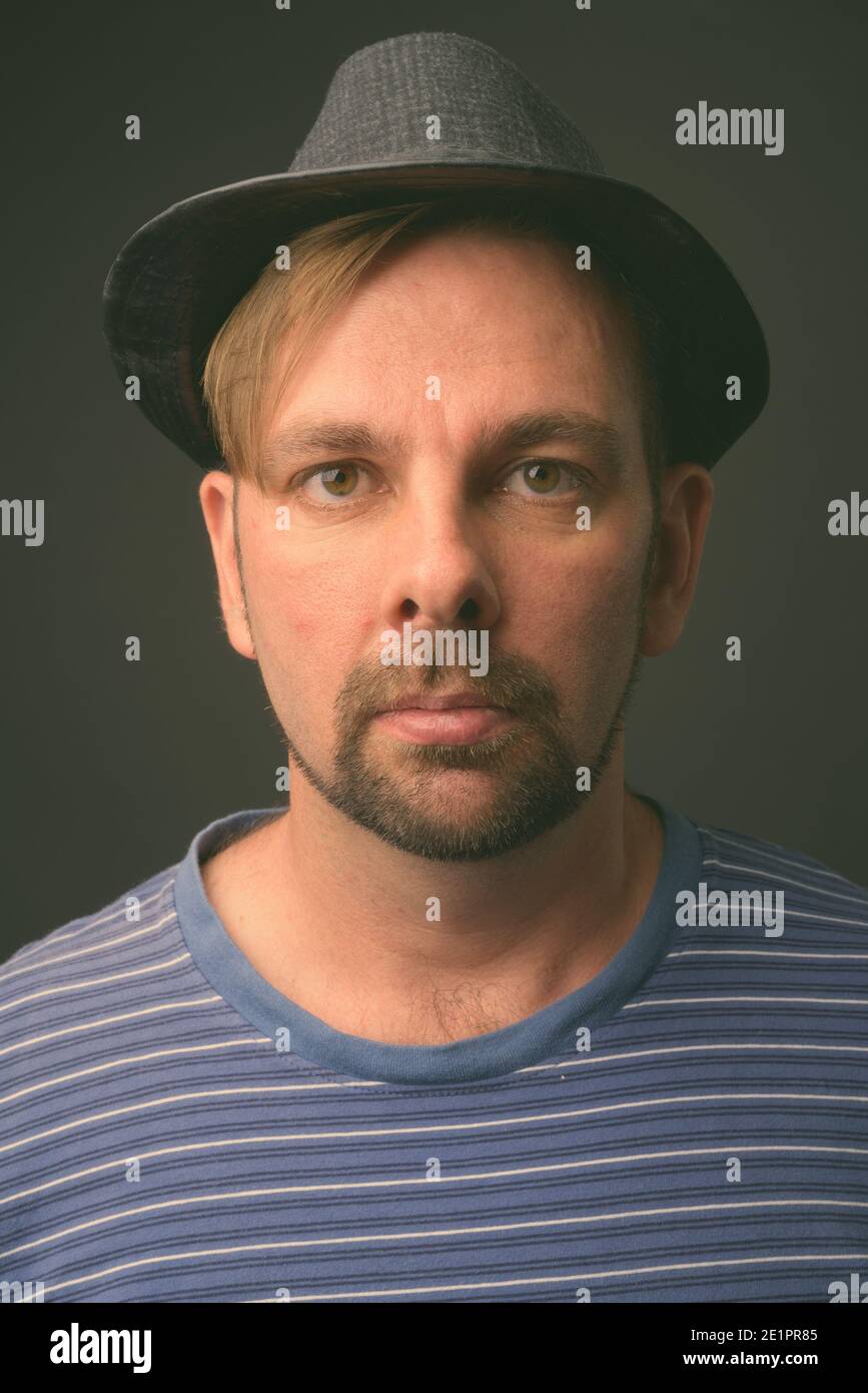 Blond bearded tourist man with goatee against gray background Stock ...