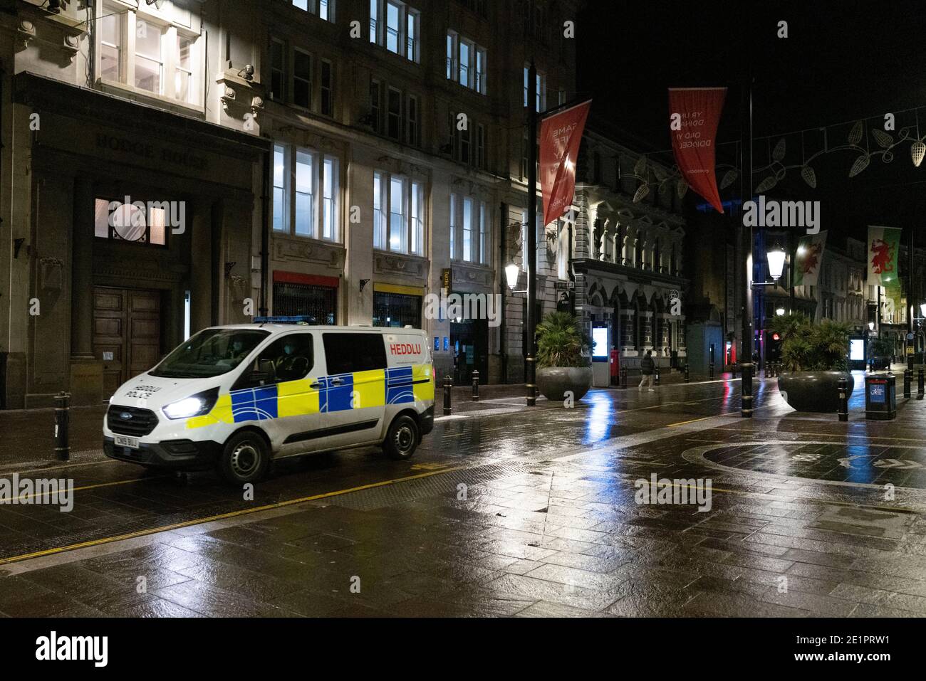 CARDIFF, WALES - JANUARY 8: A police van on empty streets in the town ...
