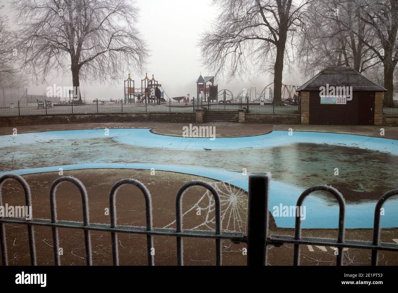View across the paddling pool in St. Nicholas Park on a frosty winter`s ...