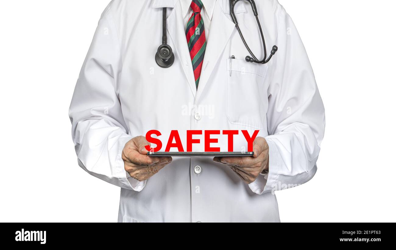 A doctor in white hospital gown holding safety banner. Isolated on ...