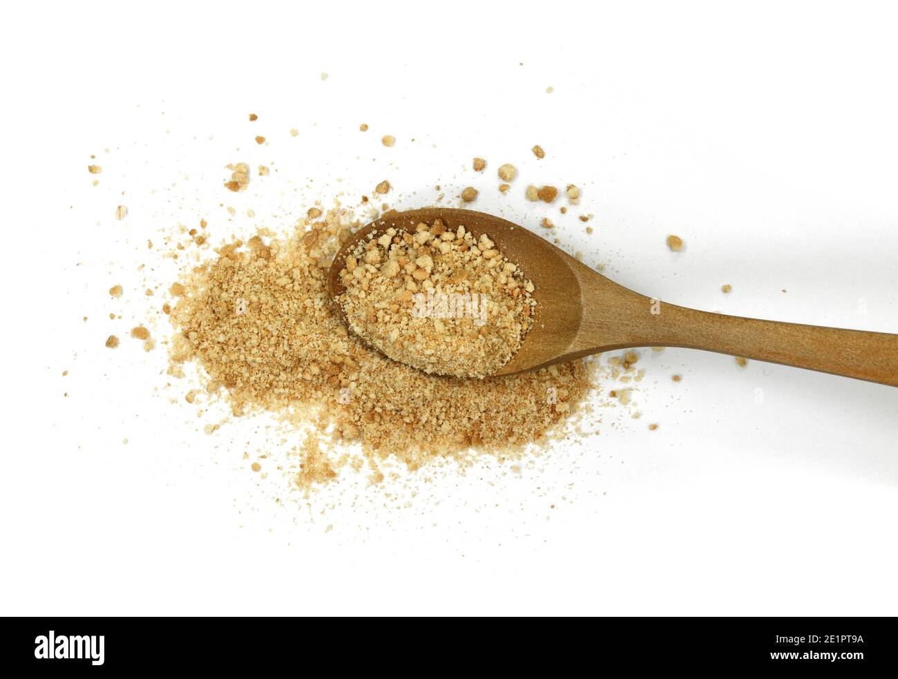 Ground biscuits in a wooden spoon on white background Stock Photo - Alamy