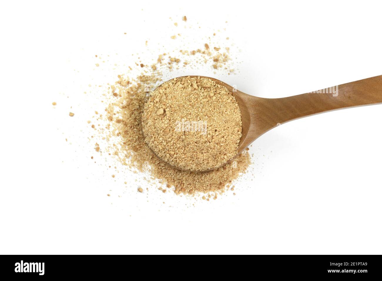 Ground biscuits in a wooden spoon on white background Stock Photo - Alamy