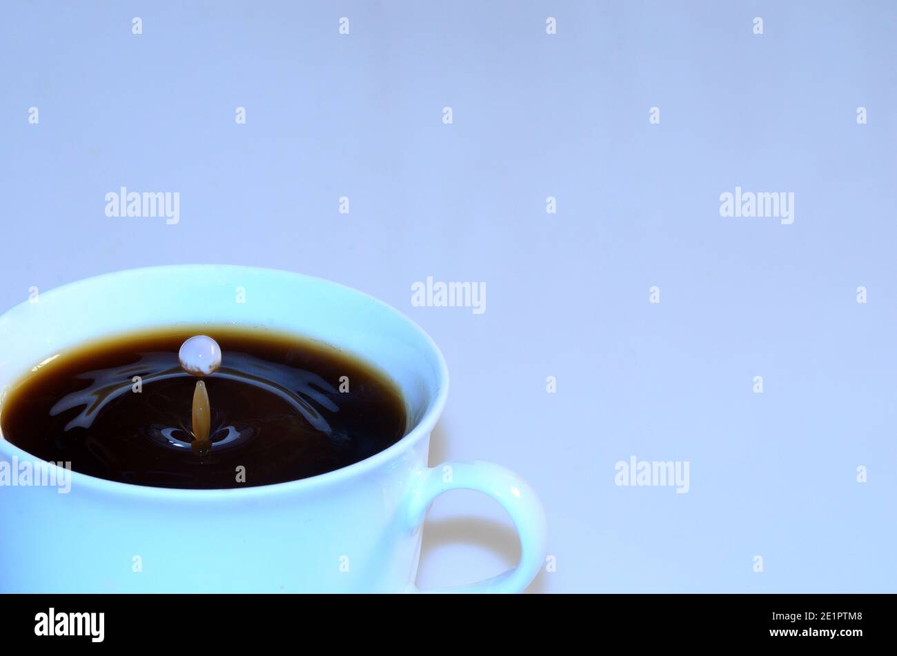 Milk drop in cup coffee hi-res stock photography and images - Alamy