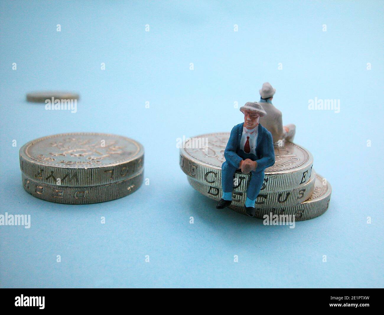 The pound £ pound coin sterling miniature models sitting on coins Stock ...