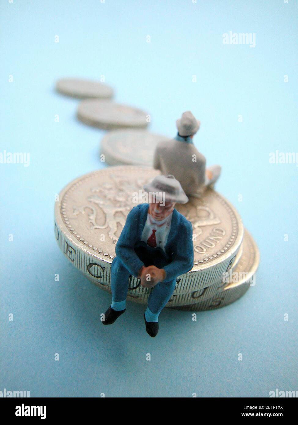 The pound £ pound coin sterling miniature models sitting on coins Stock ...