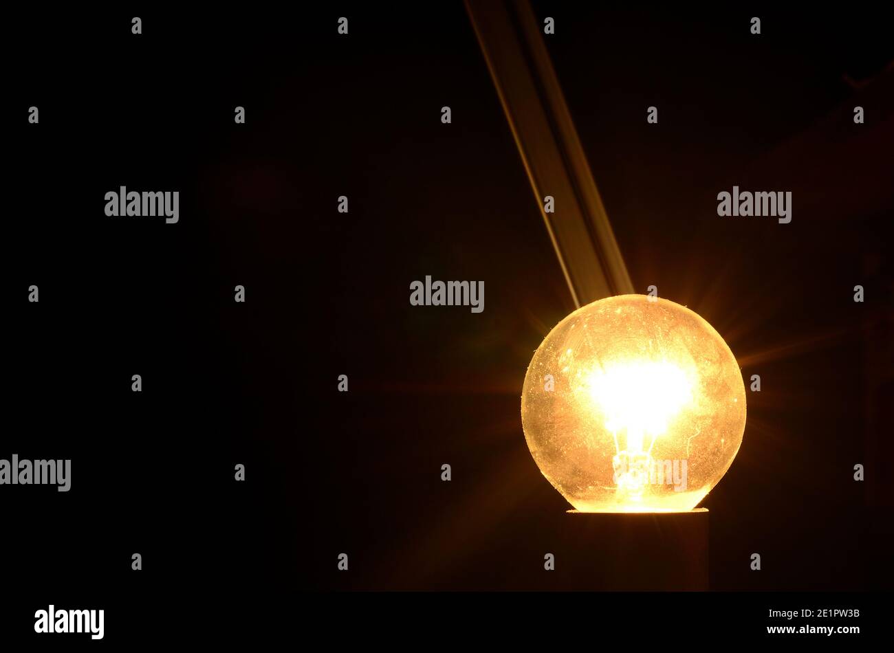 bulb lights up very bright in the dark time Stock Photo - Alamy