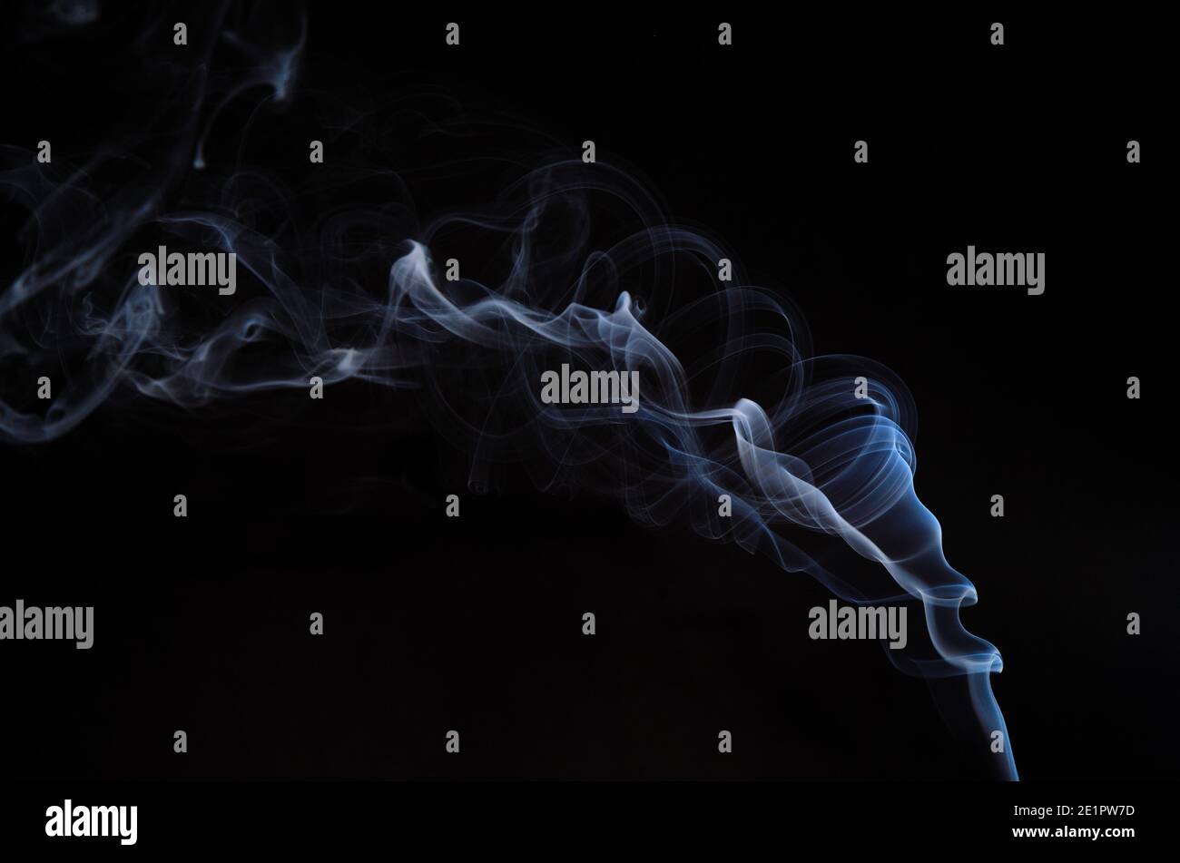 twisted blue smoke on black background Stock Photo - Alamy