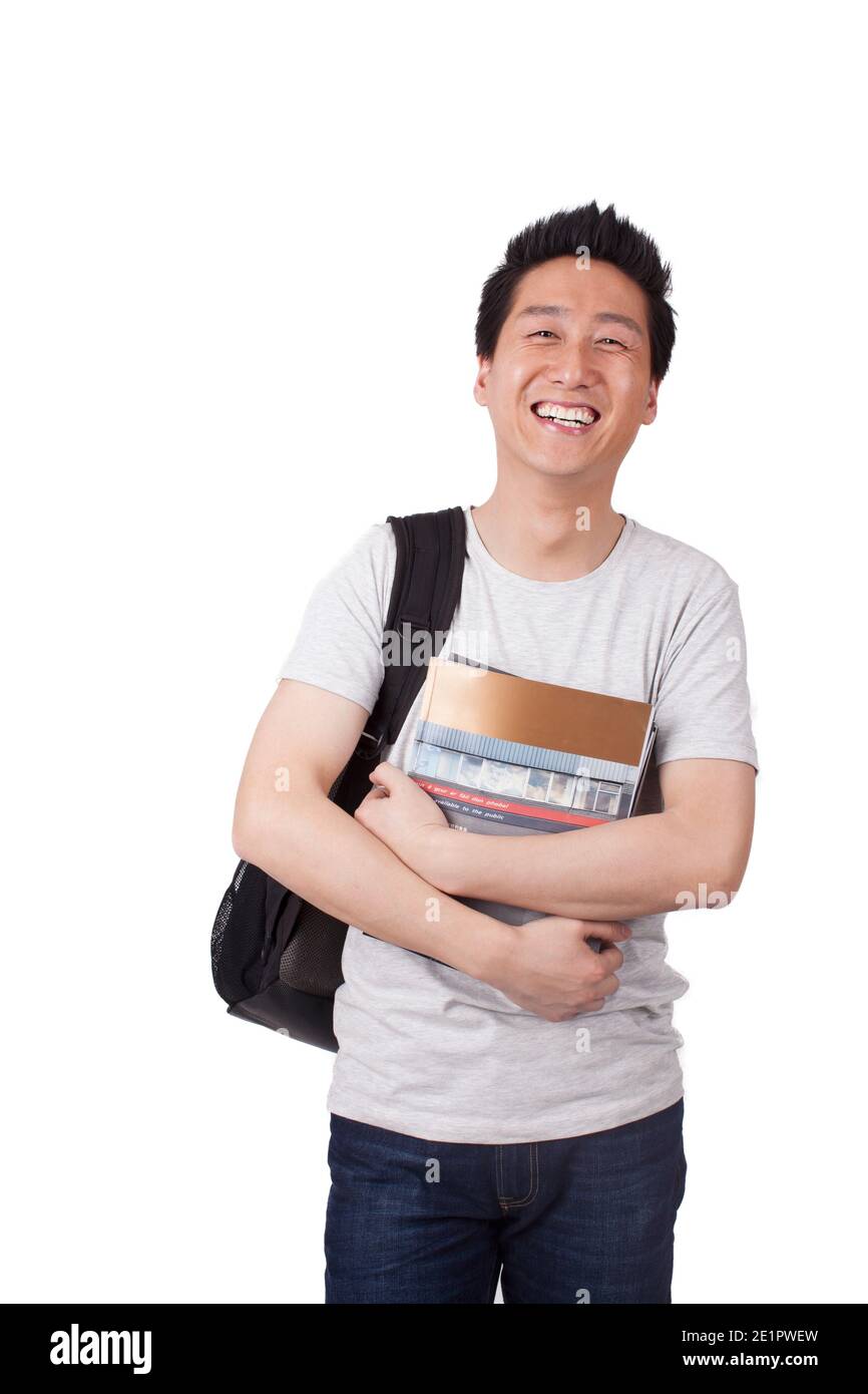 A male college student was holding a book high quality photo Stock ...
