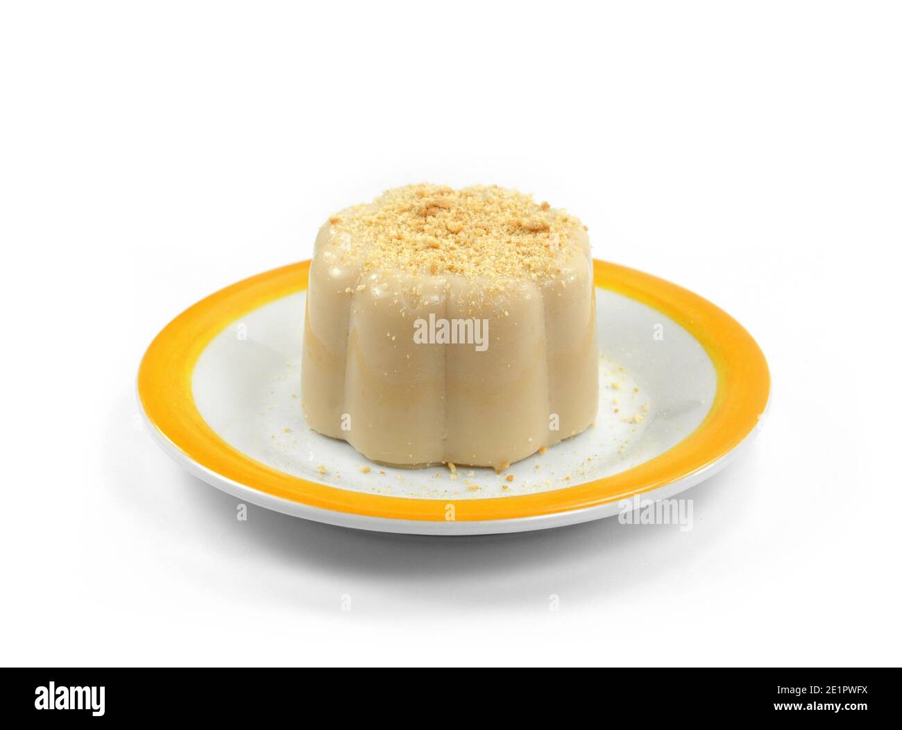 Hazelnut caramel pudding sprinkled with ground biscuits isolated on ...