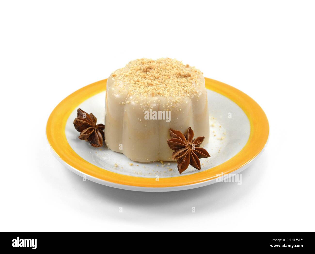 Hazelnut caramel pudding sprinkled with ground biscuits isolated on ...