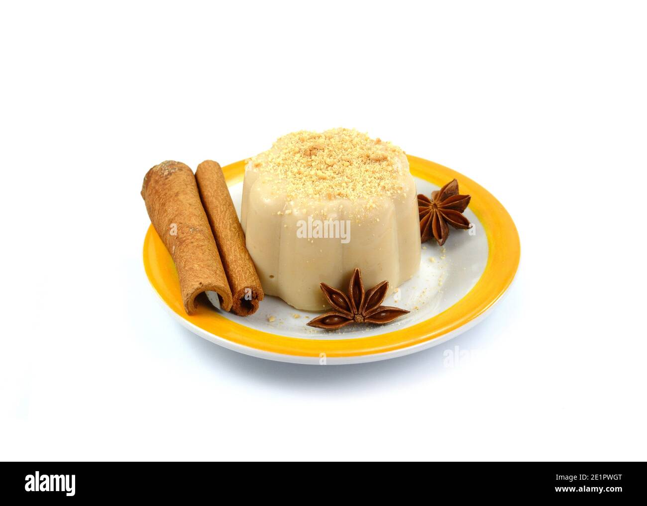 Hazelnut caramel pudding sprinkled with ground biscuits isolated on ...