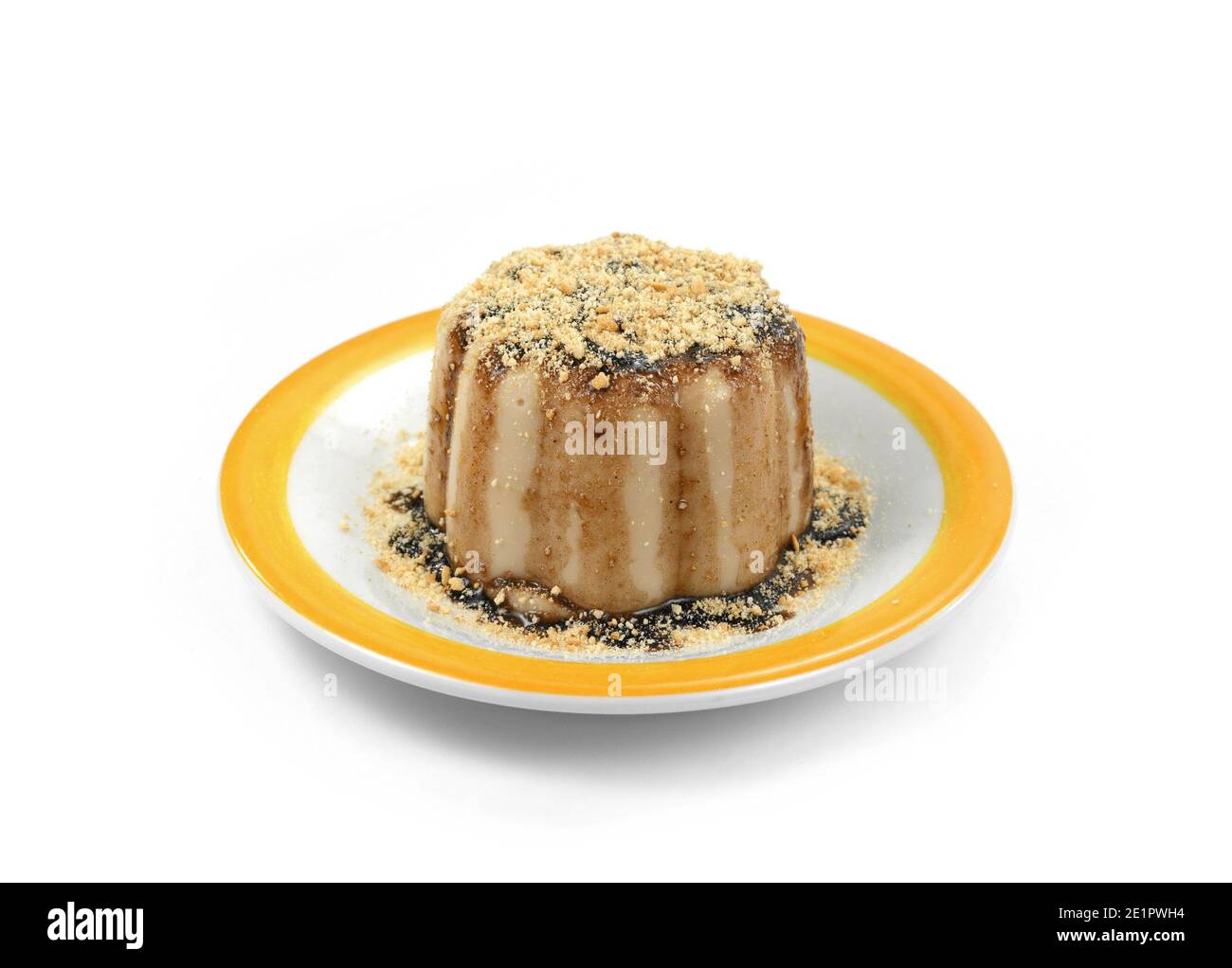 Hazelnut caramel pudding sprinkled with ground biscuits isolated on ...