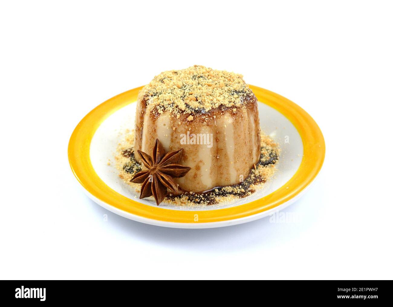 Hazelnut caramel pudding sprinkled with ground biscuits isolated on ...