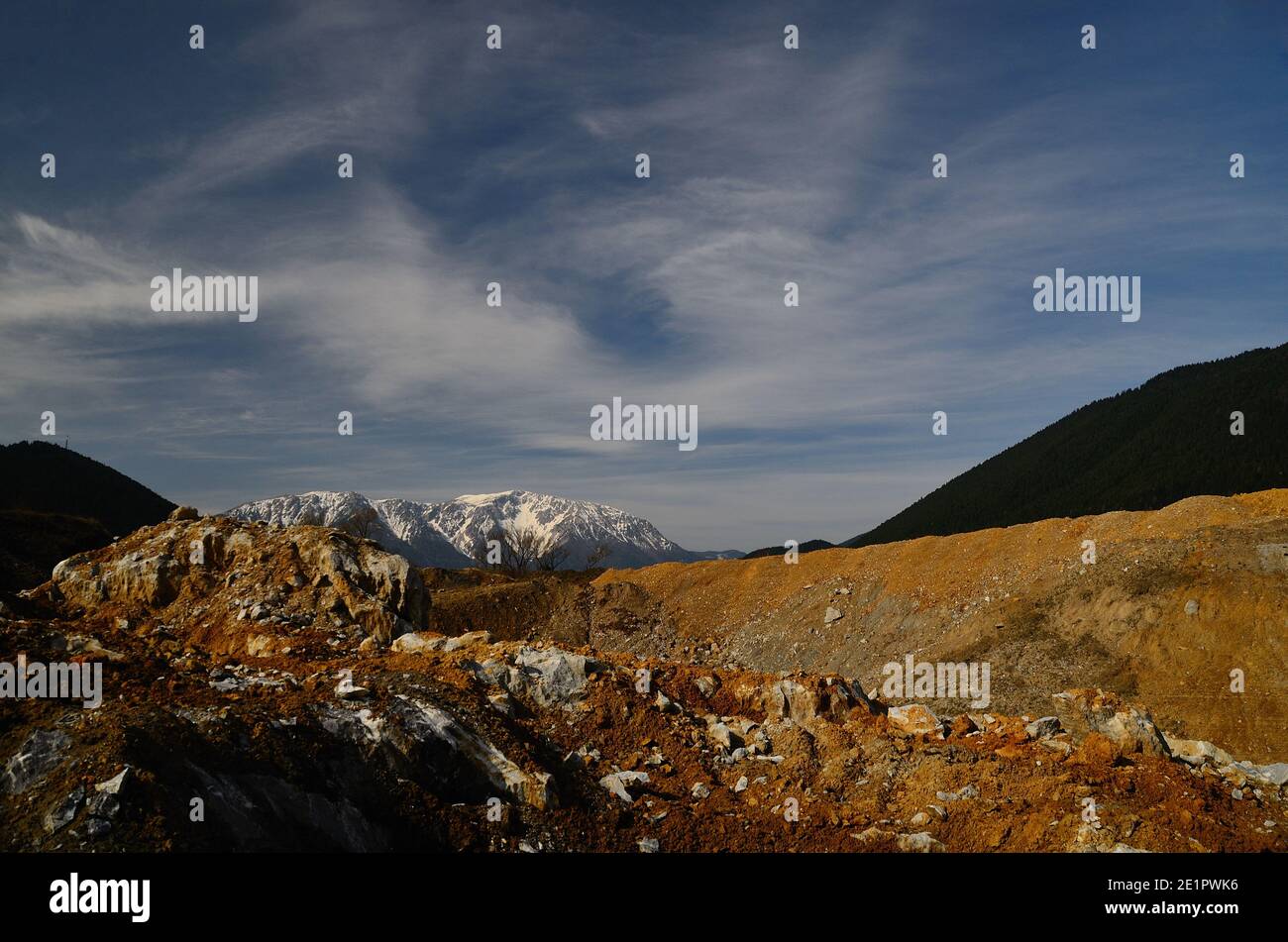 quarry with beautiful sky and snowy mountain in the background Stock ...