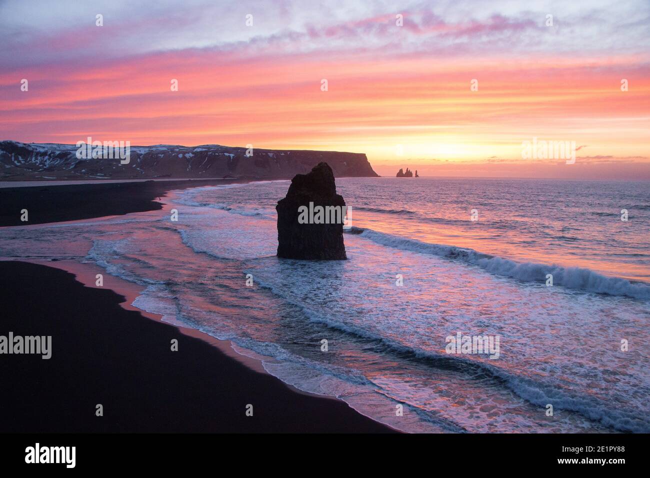 Panoramic pink pastel sky sunrise view of Kirkjufjara and Reynisfjara ...