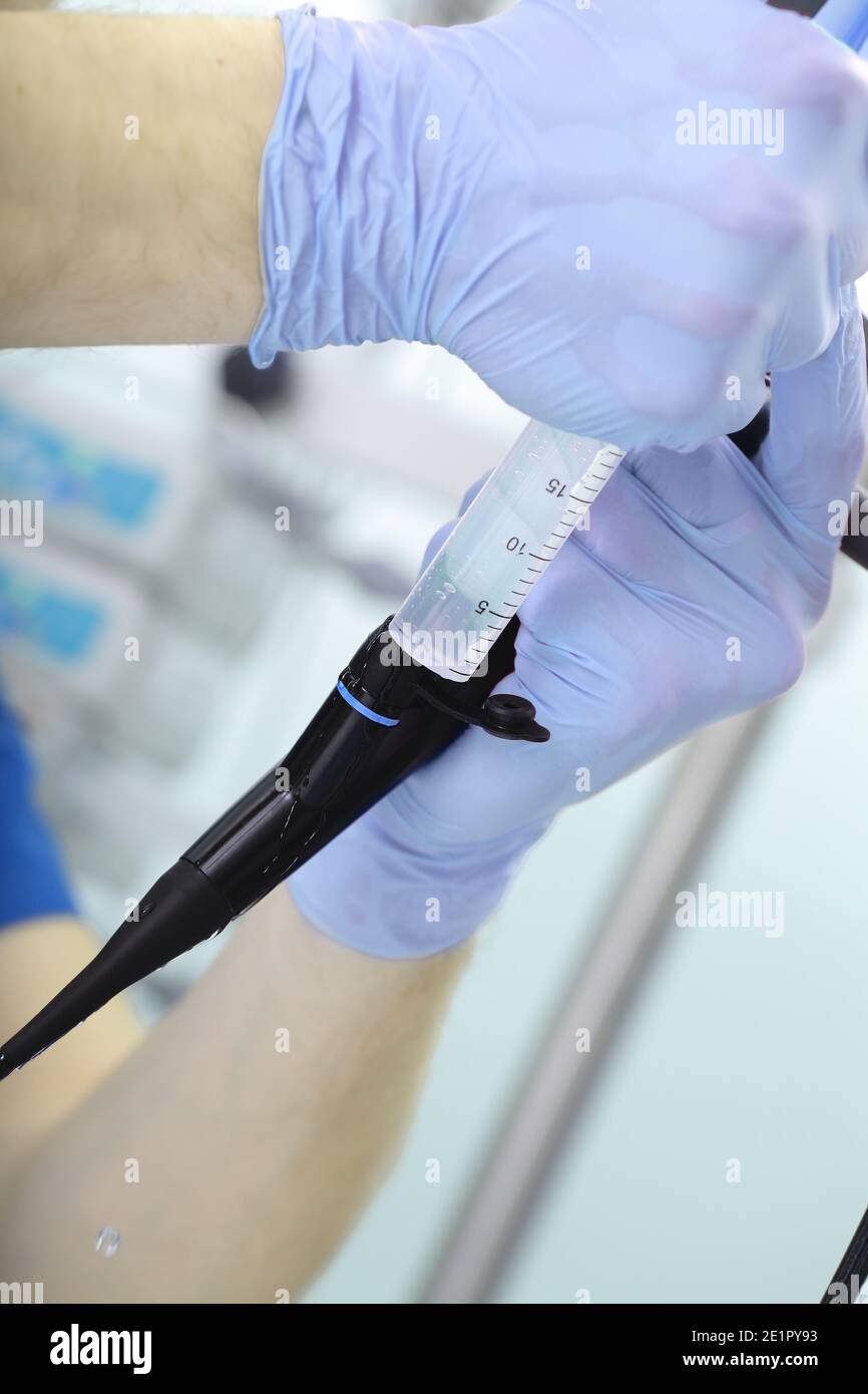 Male doctors hands with medical device Stock Photo - Alamy