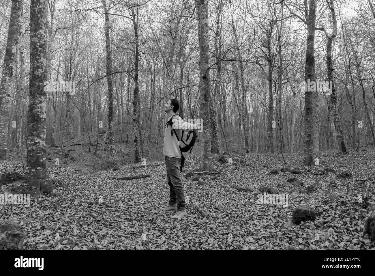 Stylish man with open arms / hands in the forest.Happiness ...