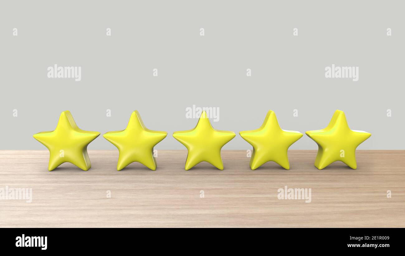 Five yellow stars on wooden table for review with white background ...