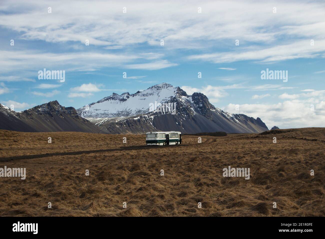 Isolated idyllic abandoned school bus parked in meadow grass field ...