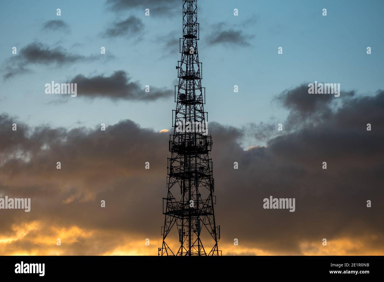 Cell phone relay tower. The construction of the mast against the blue ...