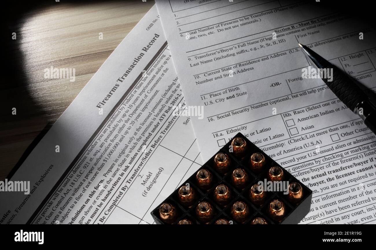 Public Domain Fbi Nics Background Check Form With A Pen And Ammunition
