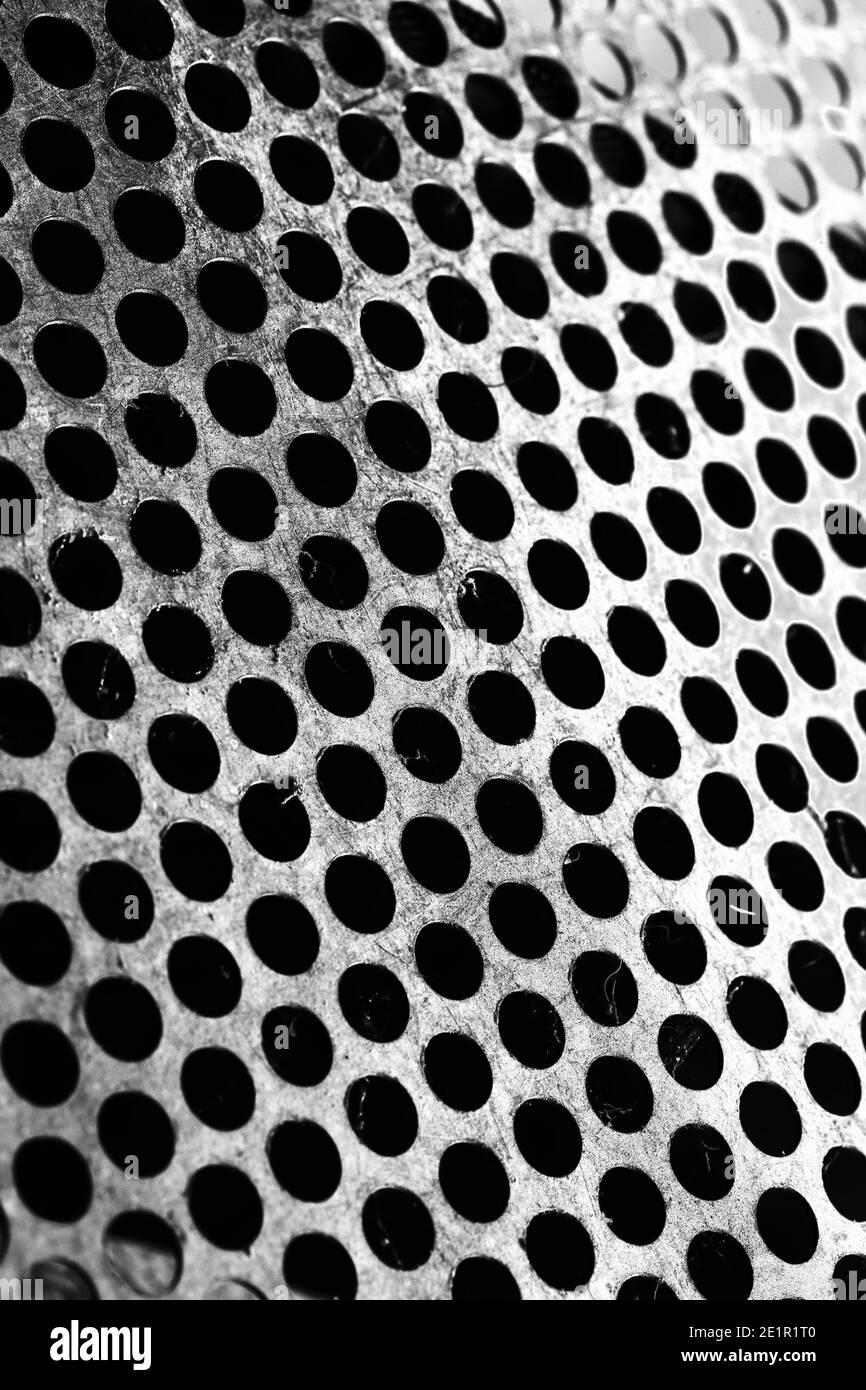 Perforated metal sheet with scraped surface Stock Photo - Alamy