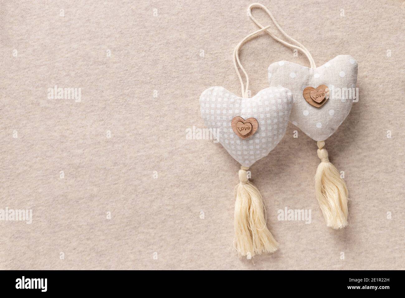 Valentines day background with two soft beige hearts Stock Photo - Alamy